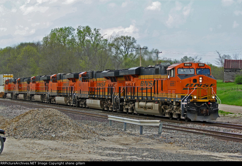 BNSF 6961 And 5 other units power a EB stack.